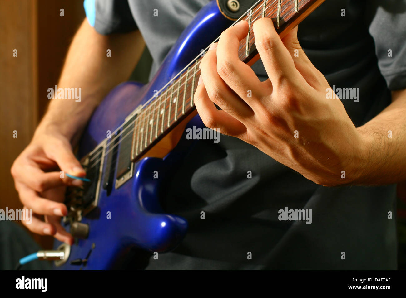 Close up guitarists hand playing hi-res stock photography and images ...