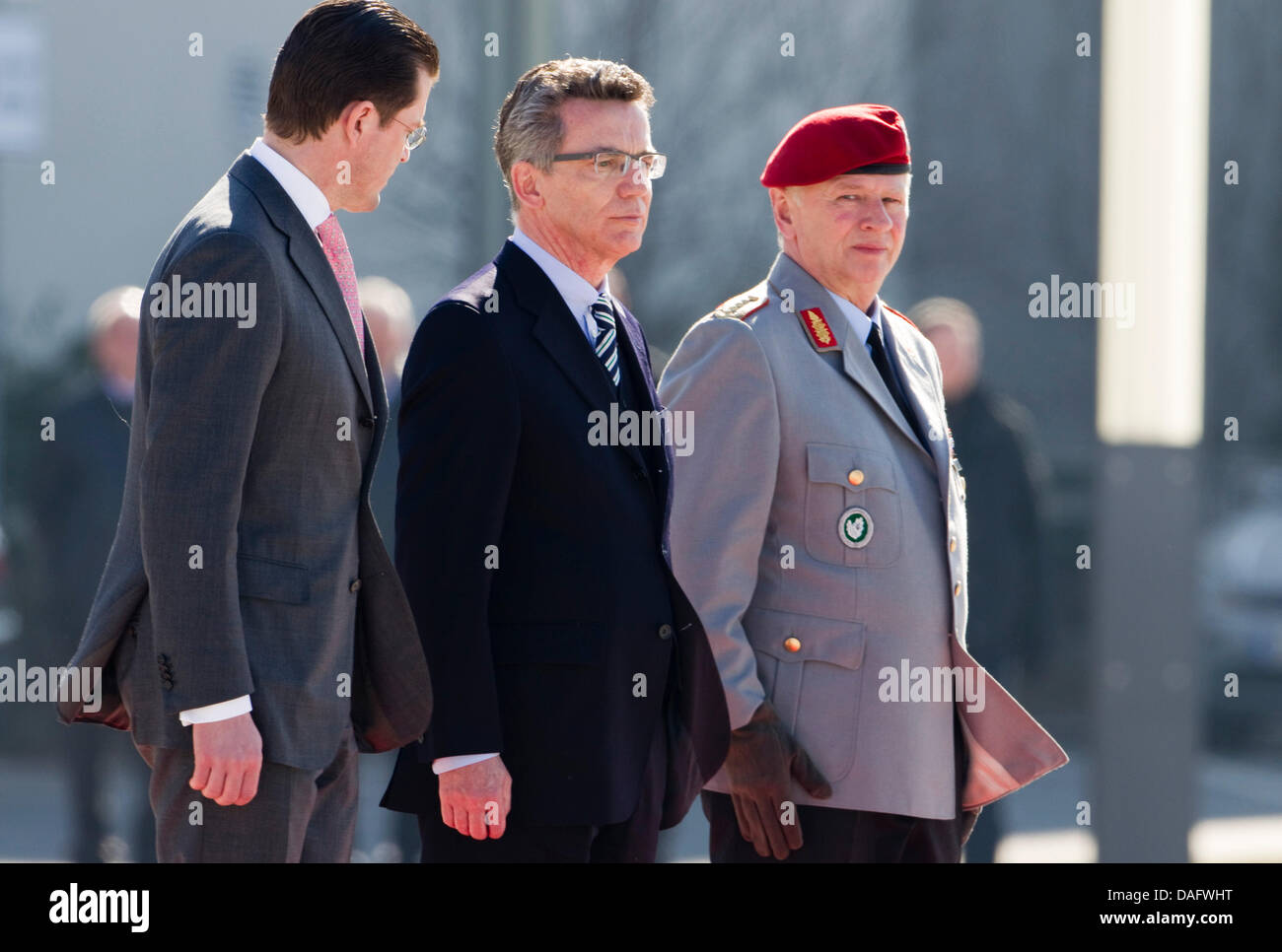(L-R:) Outgoing Defence Minister Karl-Theodor zu Guttenberg, his ...