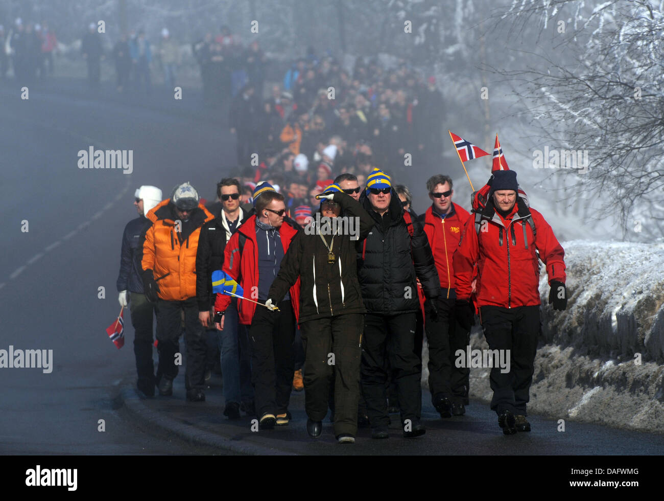 Spectators are walking towards the ski jumping venue at the Nordic ...