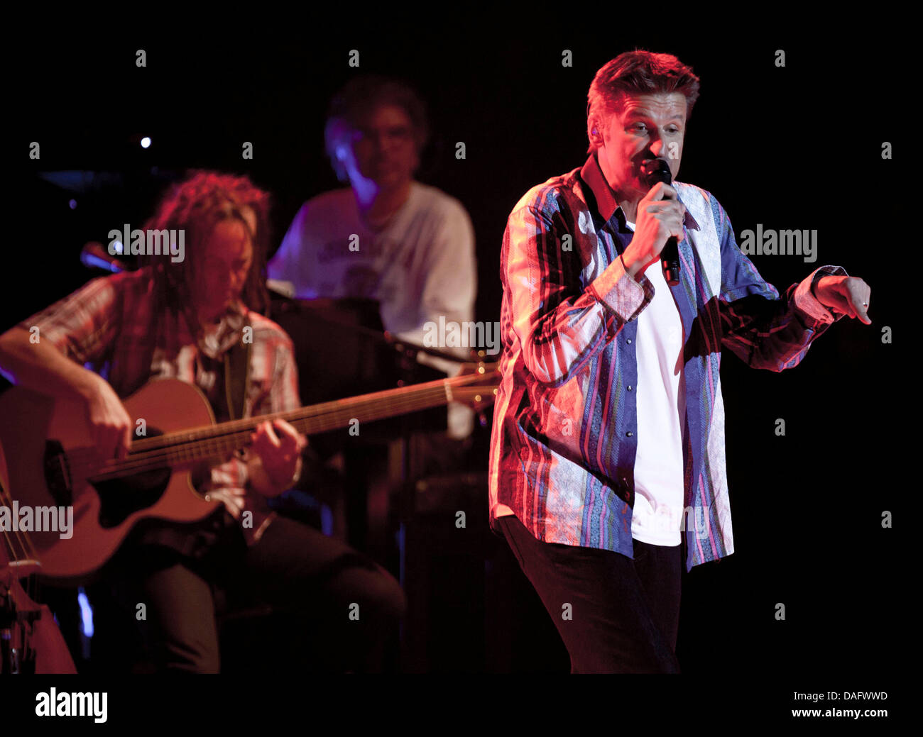 The lead singer of the German pop band PUR Hartmut Engler (R) performs ...