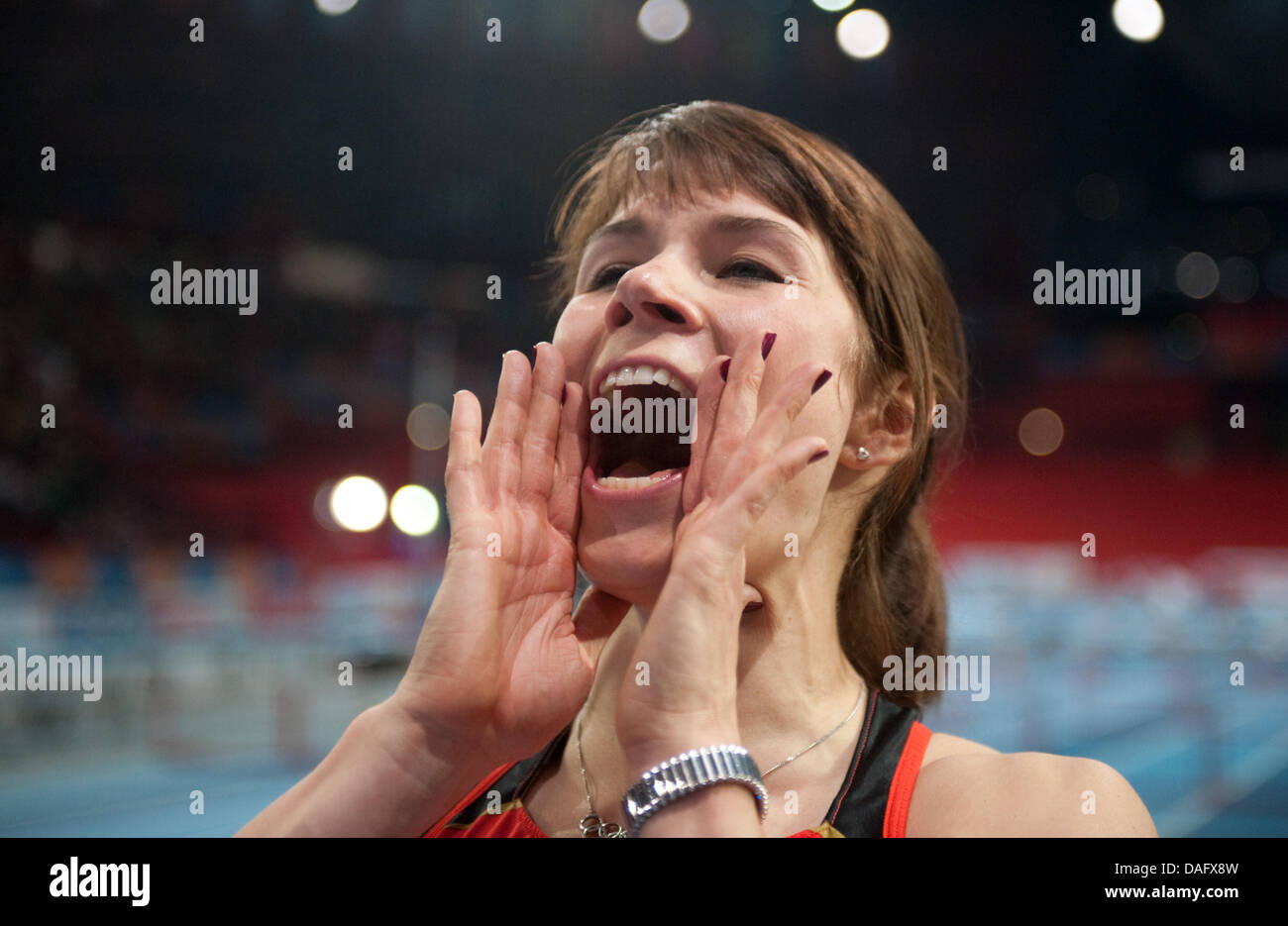 German athlete Carolin Nytra shouts during the victory ceremony of ...
