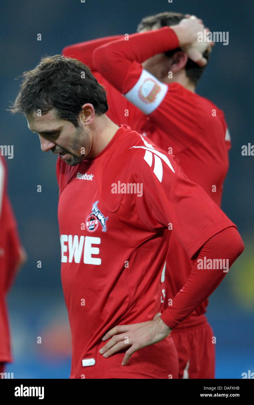 Cologne's Fabrice Ehret and Milivoje Novakovic (R) are disappointed ...