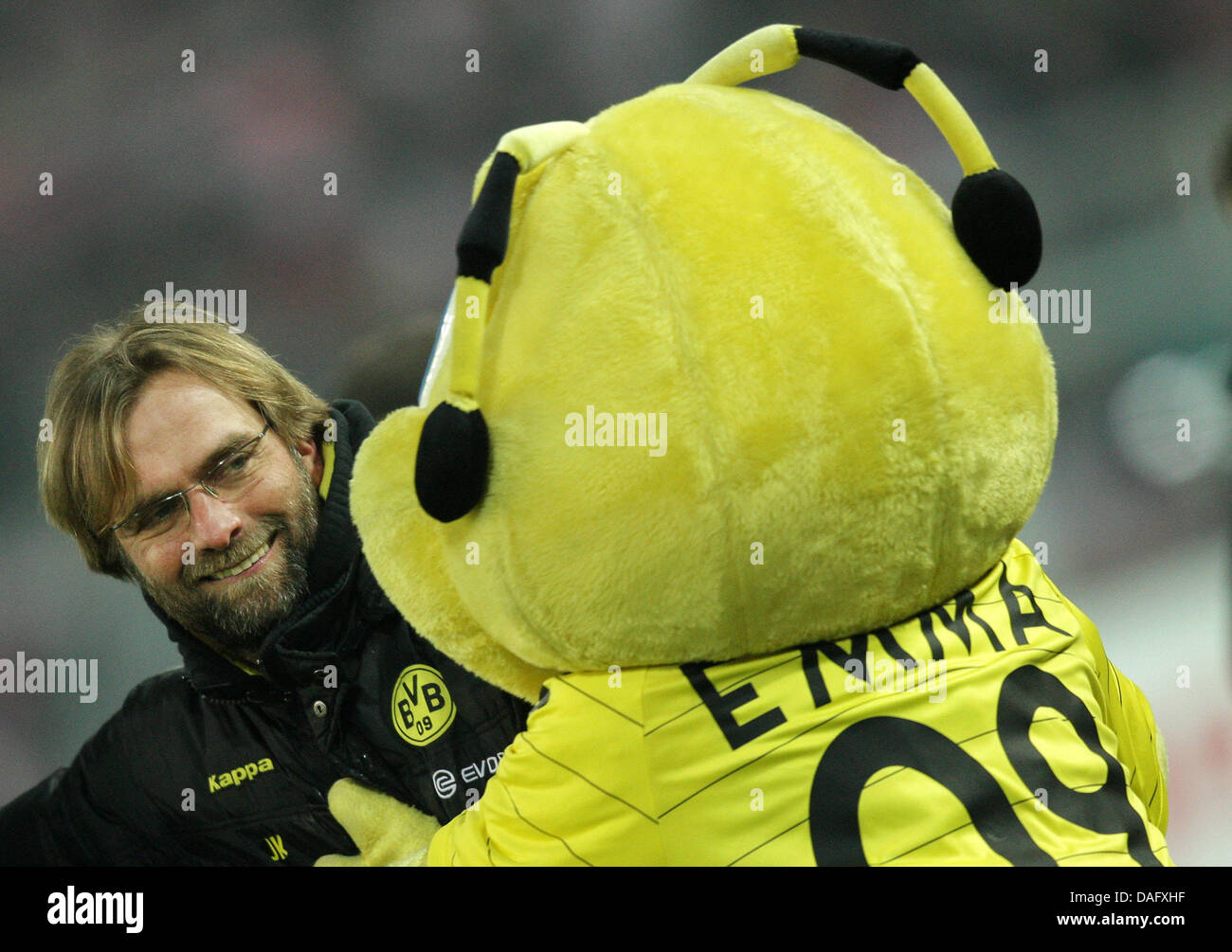 Dortmund coach Juergen Klopp gets a hug from team mascot Emma after the ...