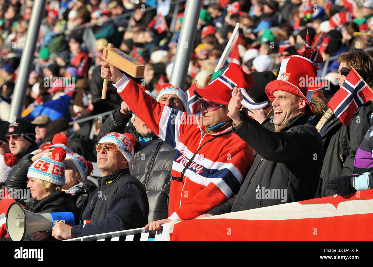 Norwegian spectators cheer during the Men's Ski Jump Large Hill team ...