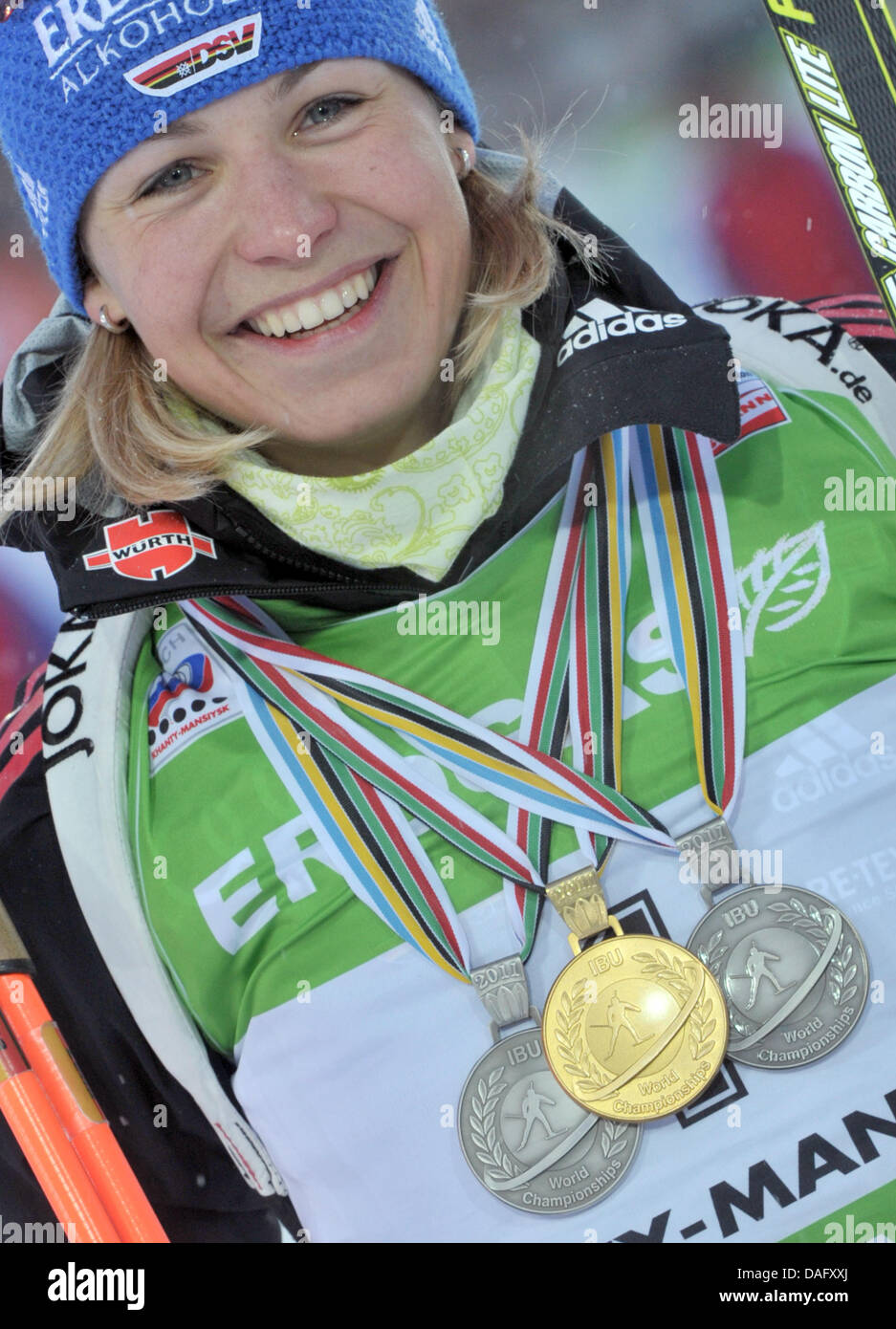 Magdalena Neuner of Germany shows her medals after the 10km pursuit at ...