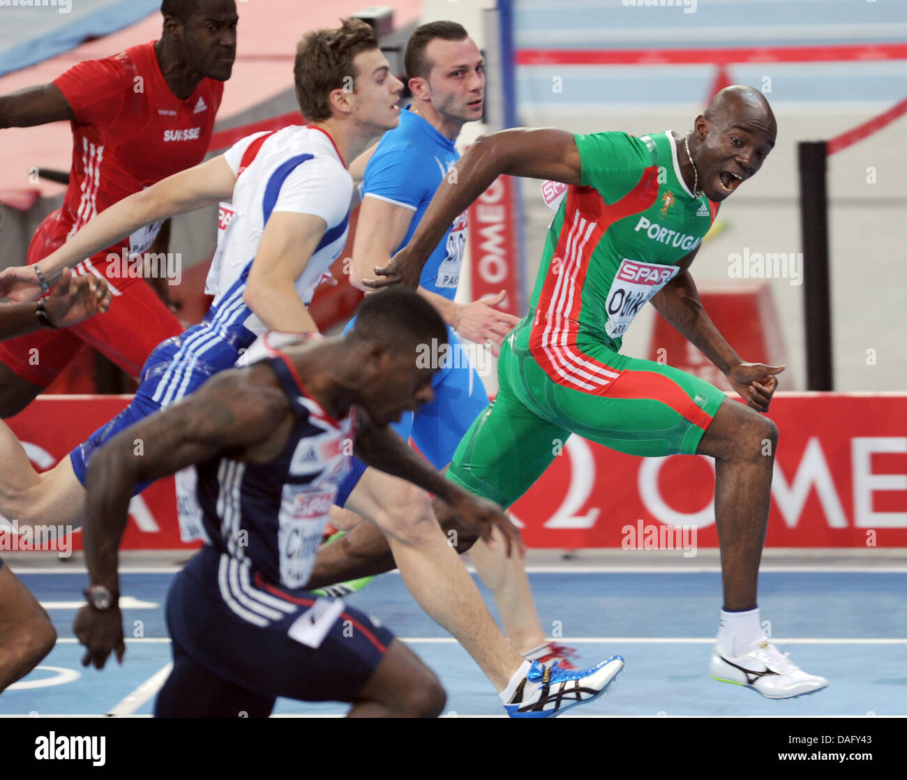 Portuguese athlete Francis Obikwelu (R) arrives at the finishing line ...
