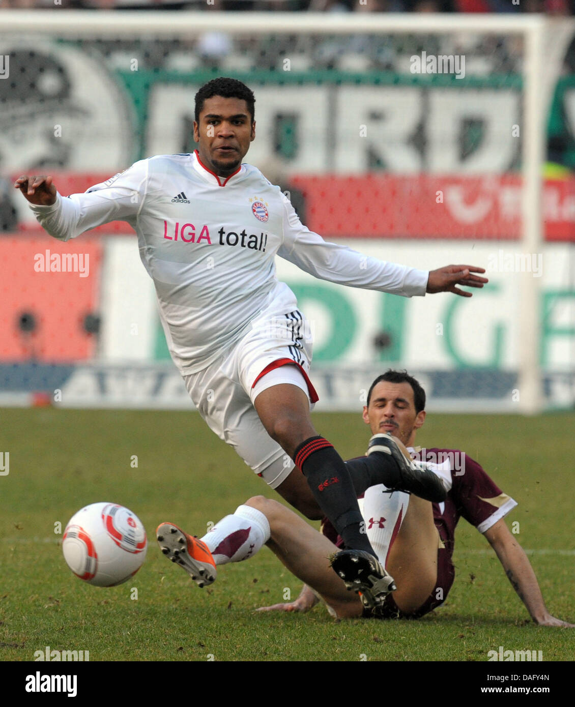 Hanover's Sergio Pinto (R) vies for the ball with Munich's Breno during ...
