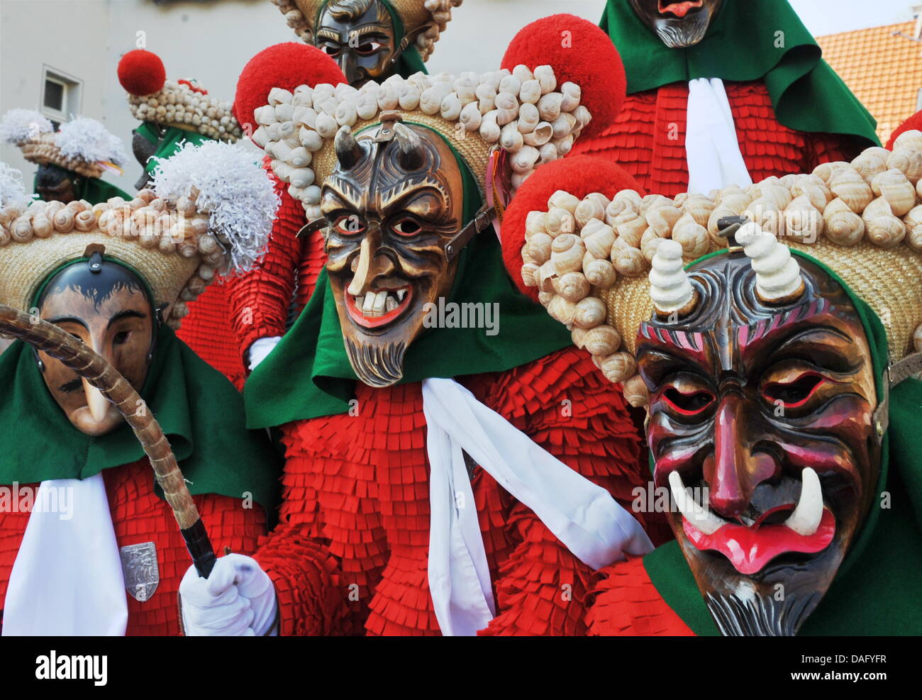 People wearing traditional masks and costumes, so-called 'Elzacher ...