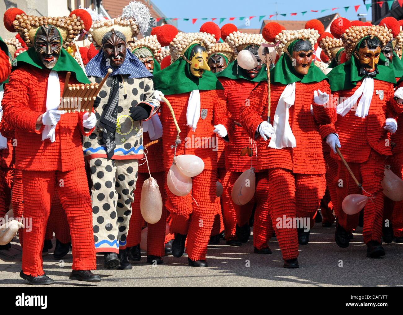 People wearing traditional masks and costumes, so-called 'Elzacher ...