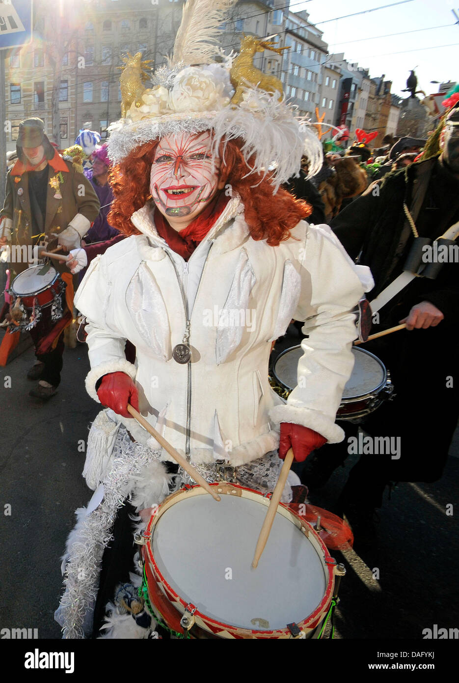 Dressed-up carnival revellers prepare for Shrove Monday parade in ...