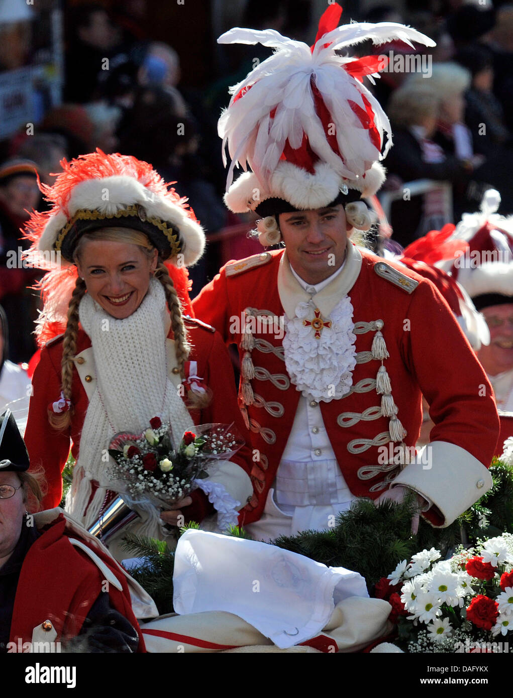Dressed-up carnival revellers prepare for Shrove Monday parade in ...