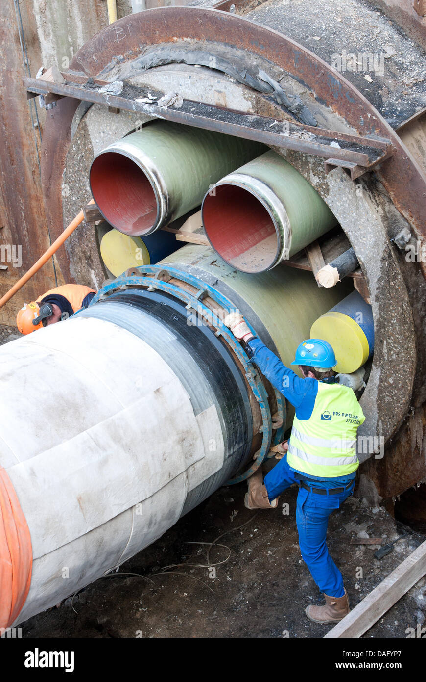Staff of PPS Pipeline Systems install a standpipe under the harbour of ...