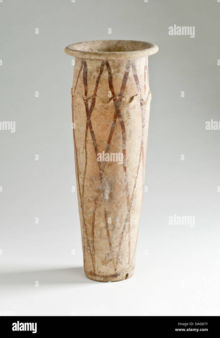 This painted cylindrical jar features intricate designs and serves as ...