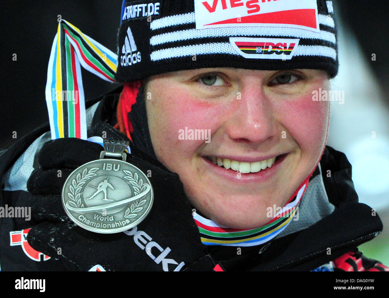 Tina Bachmann of Germany shows her silver medal after the 15 km ...