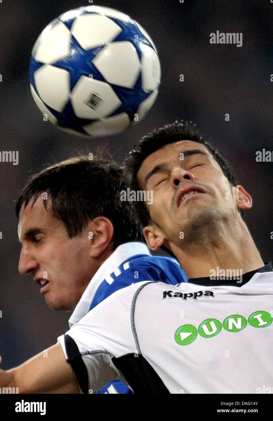 Schalke's Mario Gavranovic (L) and Ricardo Costa of Valencia fight for ...