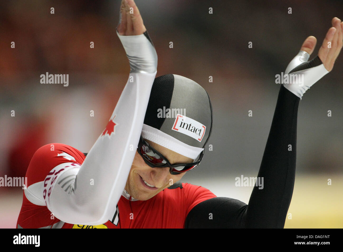Third-placed Canadian speed skater Lucas Makowsky claps after the Men's ...