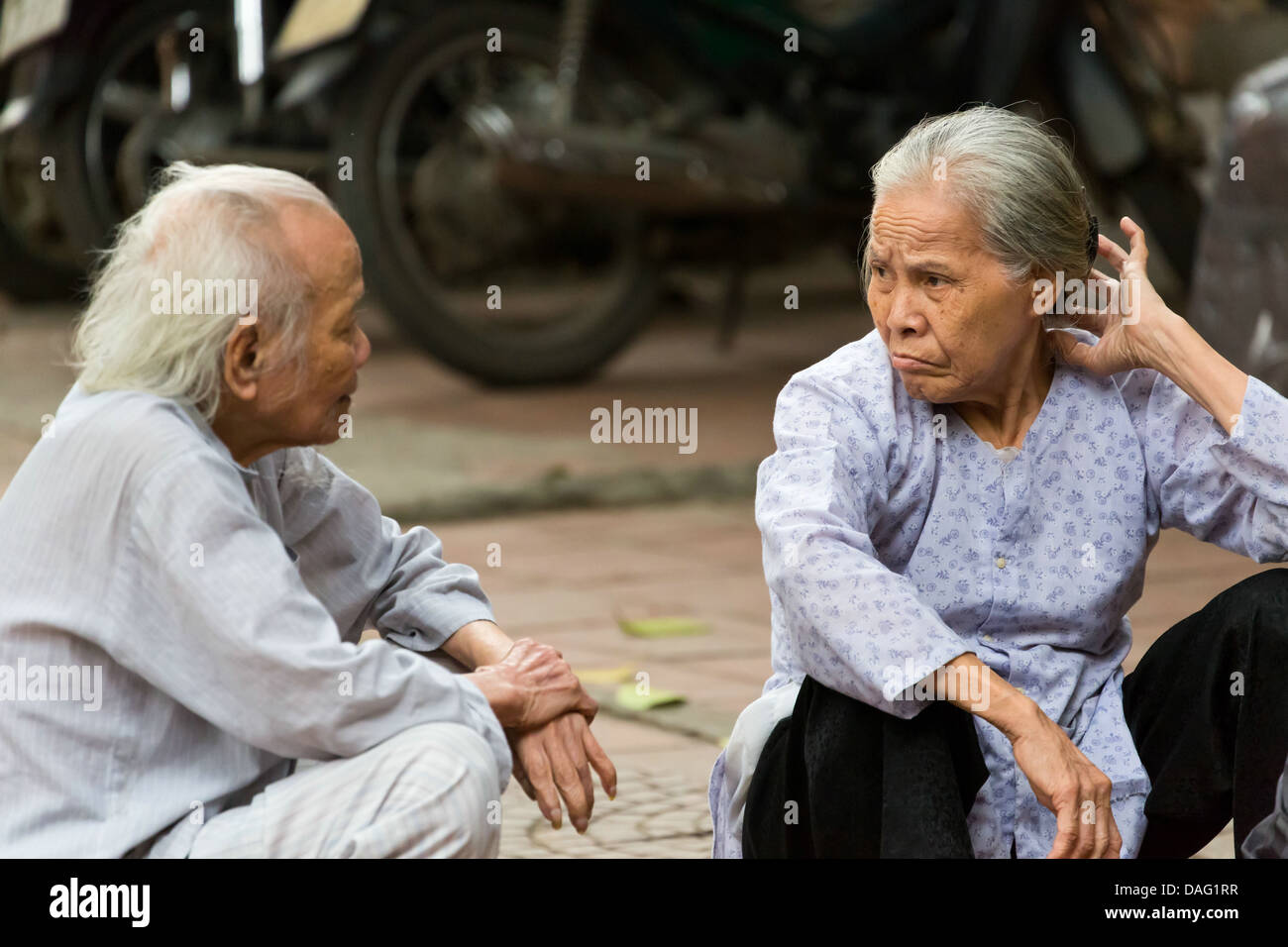 Old Vietnamese Woman in the Streets of the Old Quarter in Hanoi ...