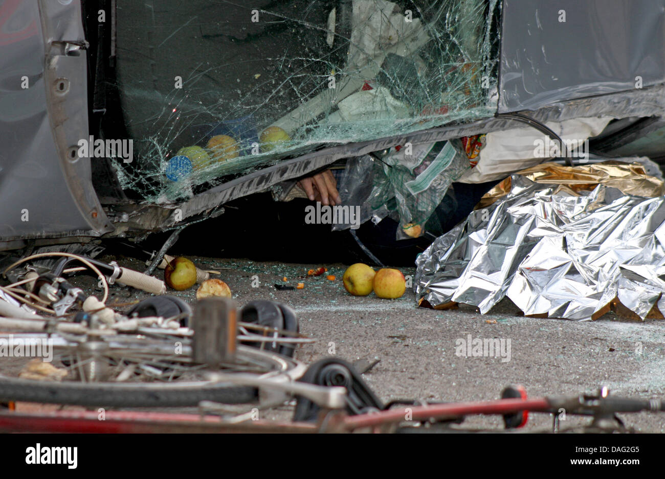 A human hand hangs from a car wreck at the site of an accident in ...