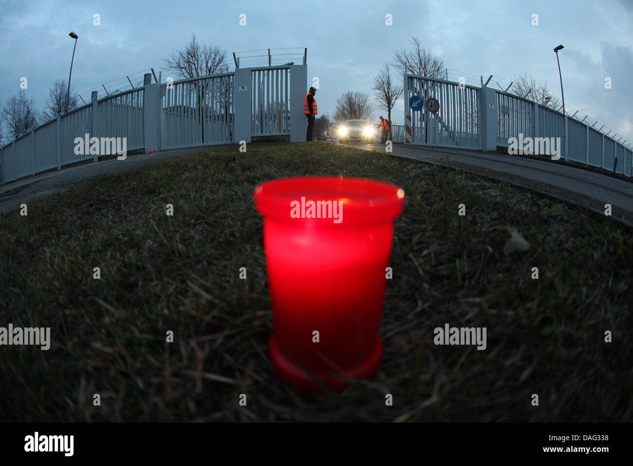 The picture shows a candle standing at an anti-nuclear vigil at the ...
