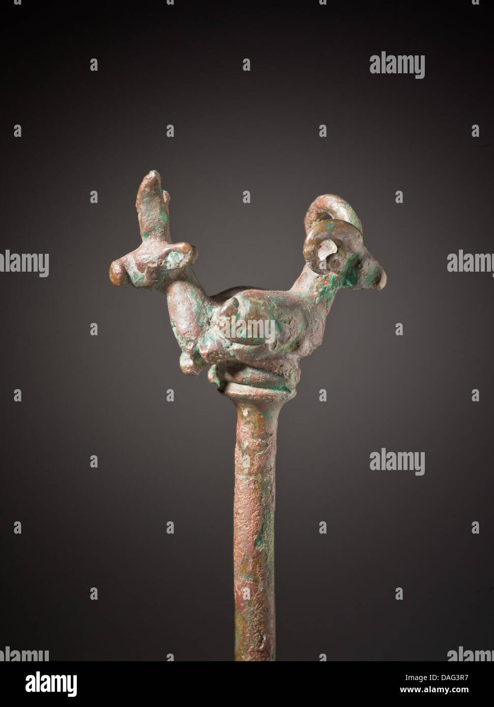 This pin features two seated ibex, sculpted in bronze, reflecting ...