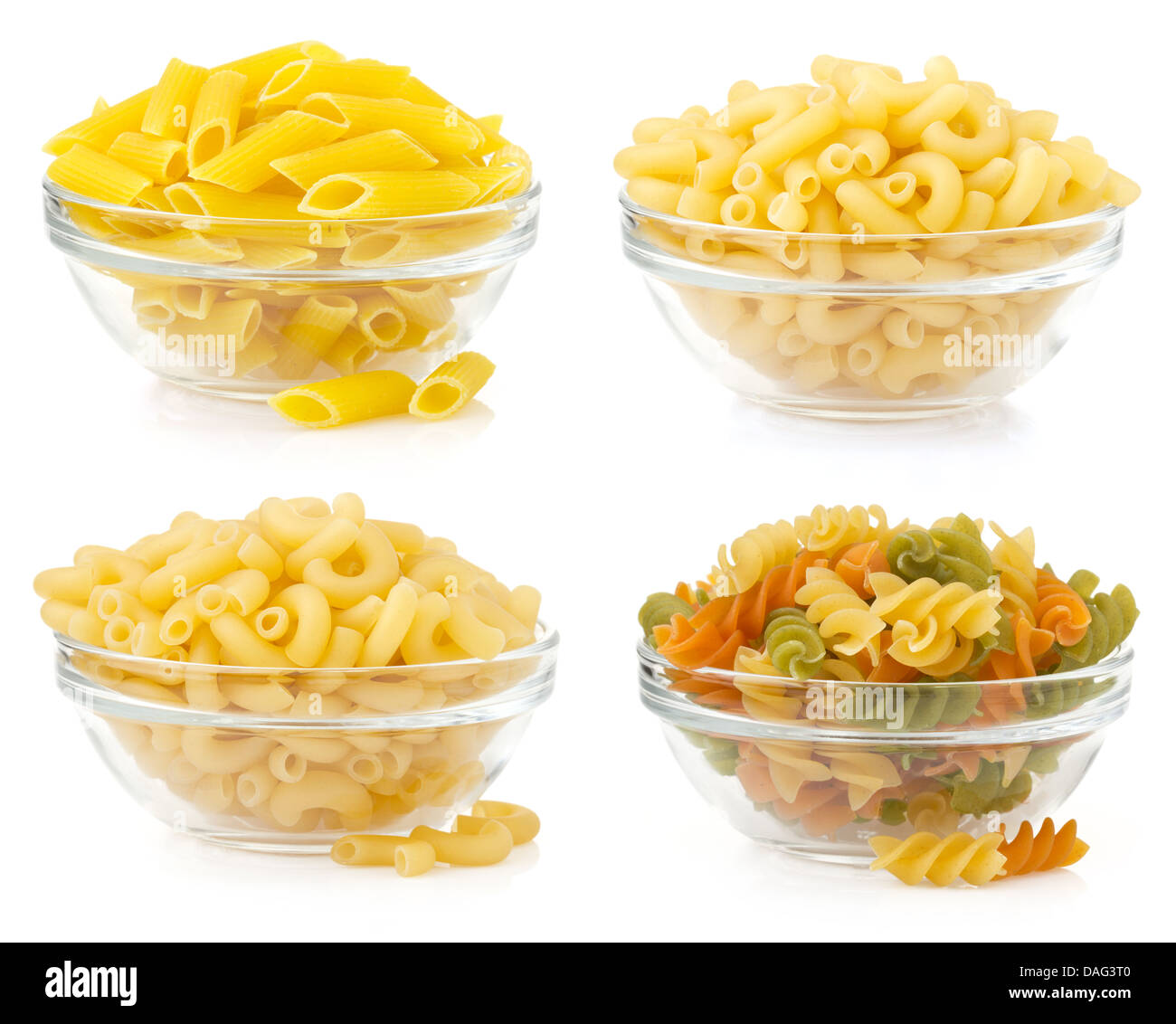 raw pasta in bowl isolated on white background Stock Photo - Alamy