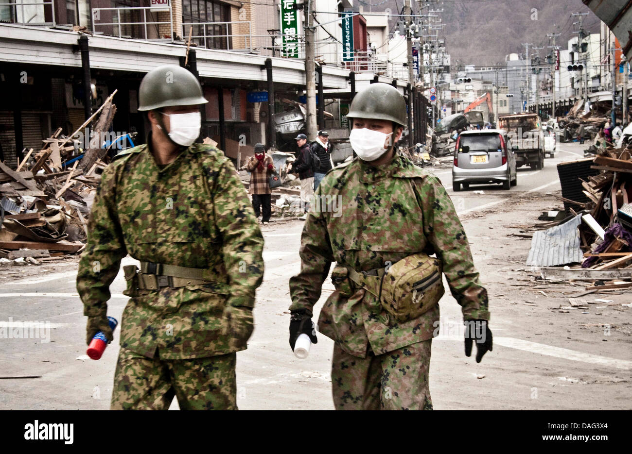 Two members of the Japan Self-Defense Forces wear masks around 100 ...