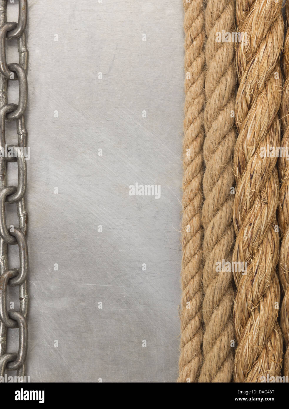 chain and ship rope on metal texture background Stock Photo - Alamy