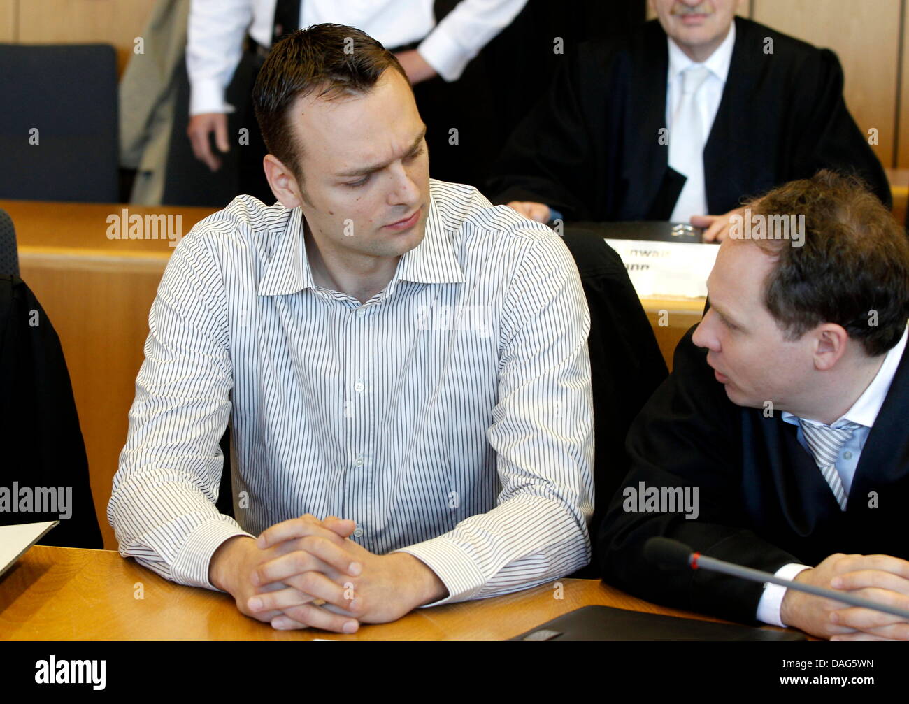 Ivan P. (L), accused of organised fraud, is in the dock as his trial ...