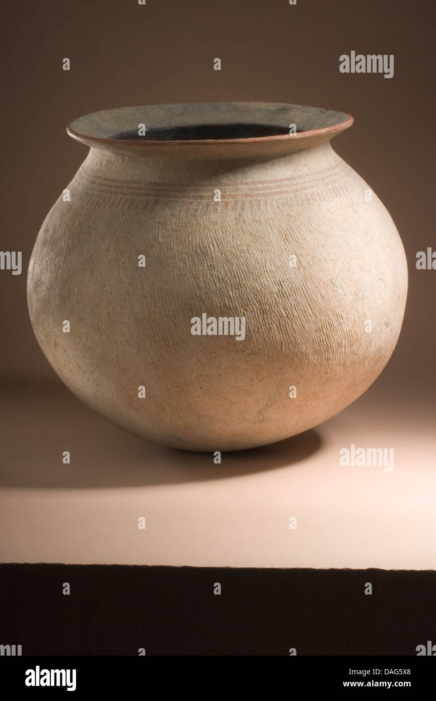 This ceramic pot, with a slightly flaring rim, is an example of ancient ...