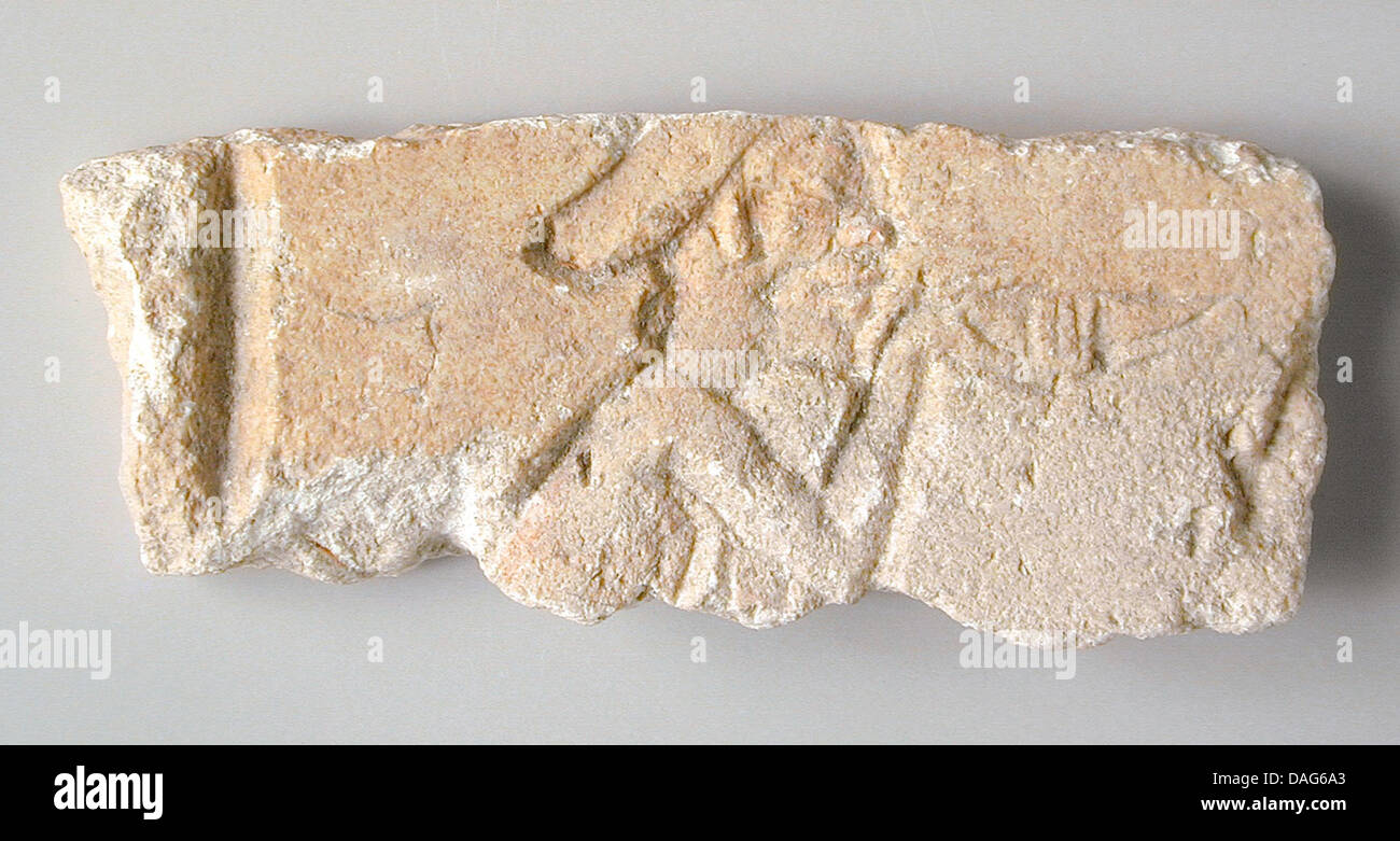 A relief sculpture depicting a human figure in dynamic pose ...