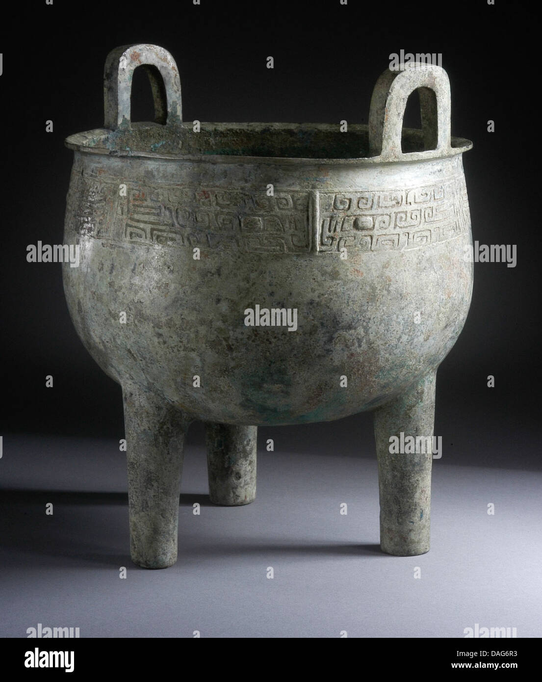 A ritual food cauldron (Ding) with intricate mask motifs, used in ...