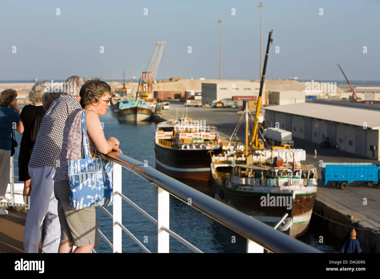 Oman, Salalah, Port, MV Minerva passengers looking at local dhows Stock ...