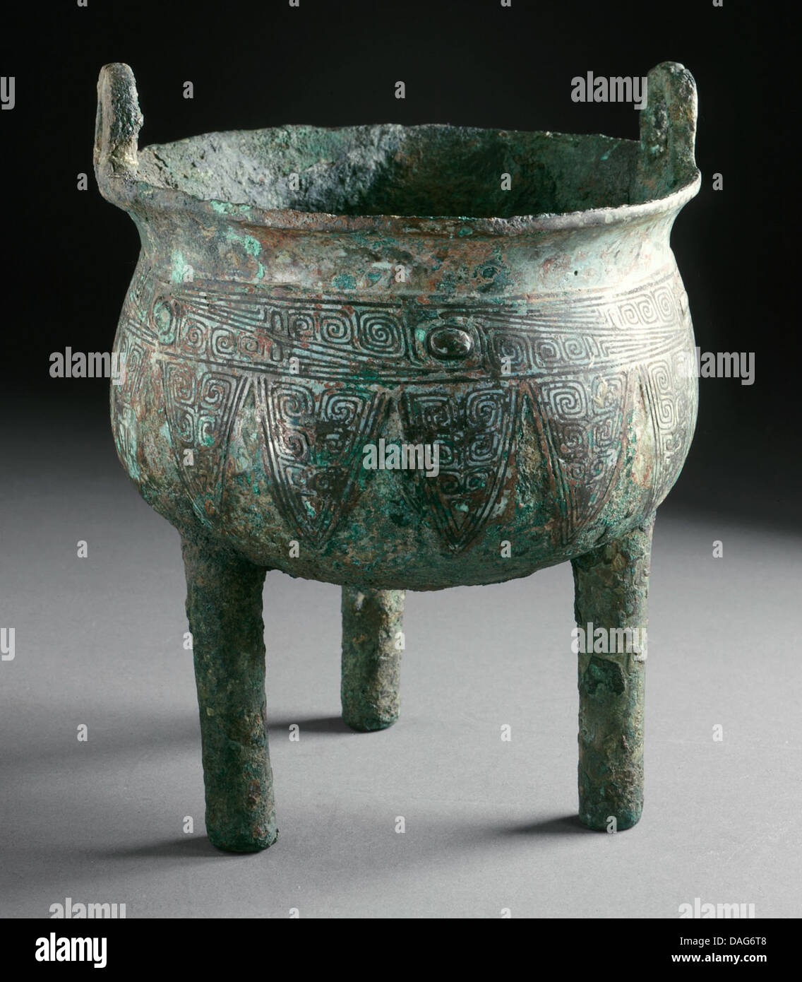 A ritual food cauldron (Ding) with spiral motifs, dating from ancient ...