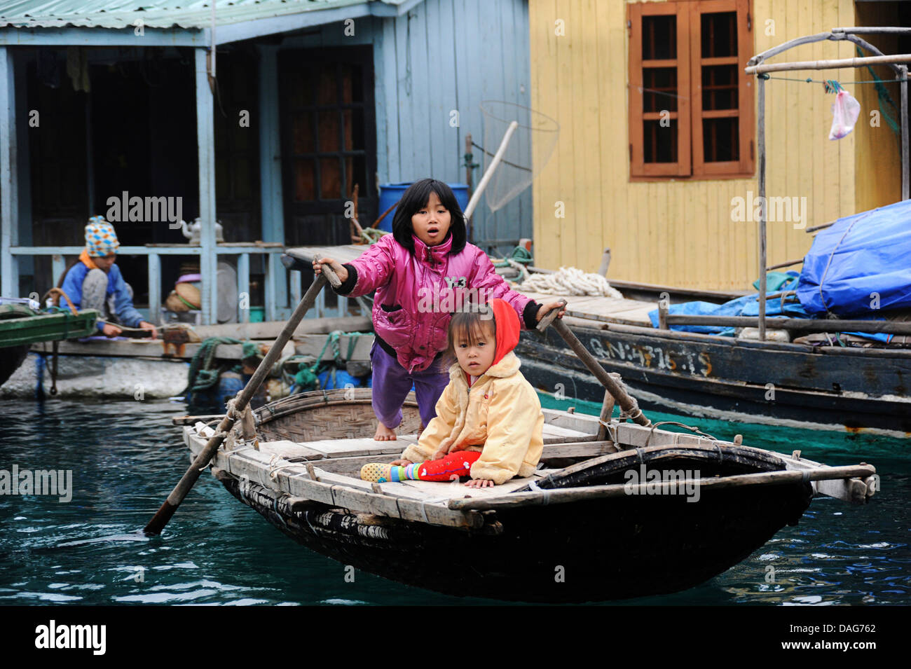 Children in a boat, rowing. Halong Bay, Vietnam Stock Photo - Alamy