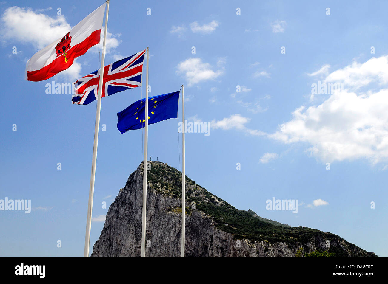 flags of Gibraltar, Great Britain and Europe blowing in the wind ...