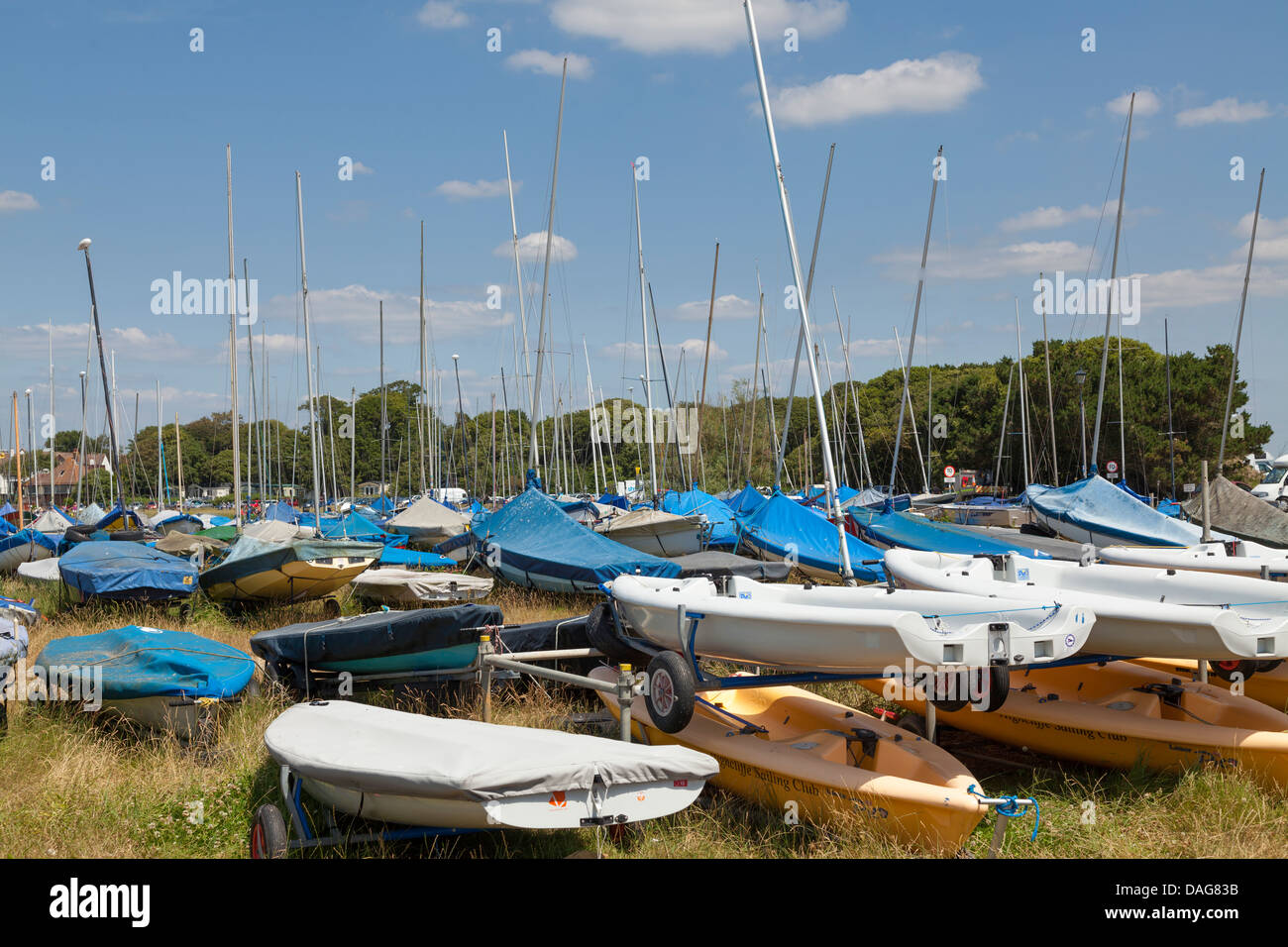 covered dinghys in trailer park Stock Photo - Alamy