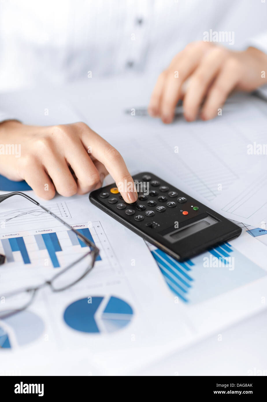 woman hand with calculator and papers Stock Photo - Alamy