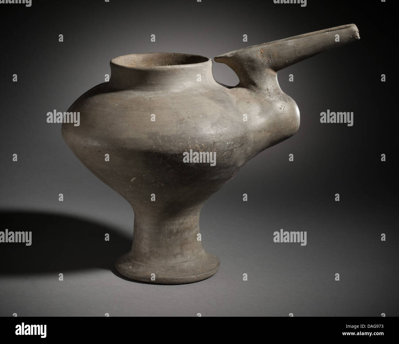 This spouted jar, mounted on a pedestal, combines functional design ...