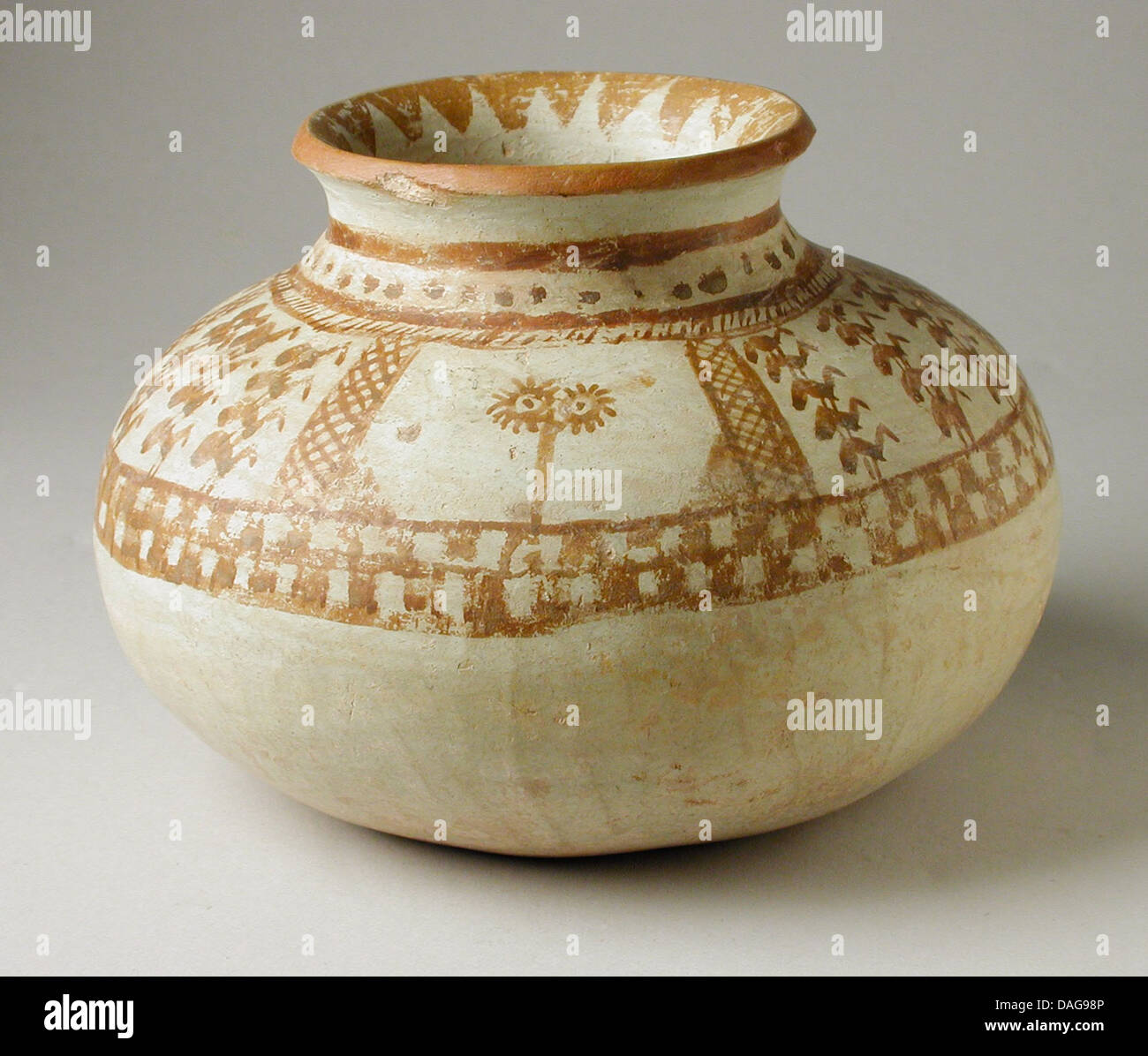 This squat jar, crafted from pottery, is a utilitarian object with a ...