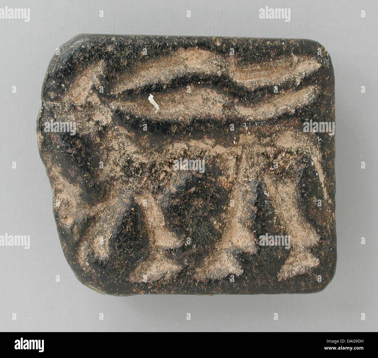 This stamp features a gabled design, typically used in ancient cultures ...