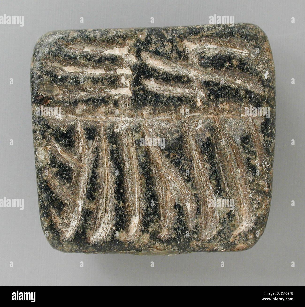 This stamp is a gabled design with a rounded back, showcasing intricate ...