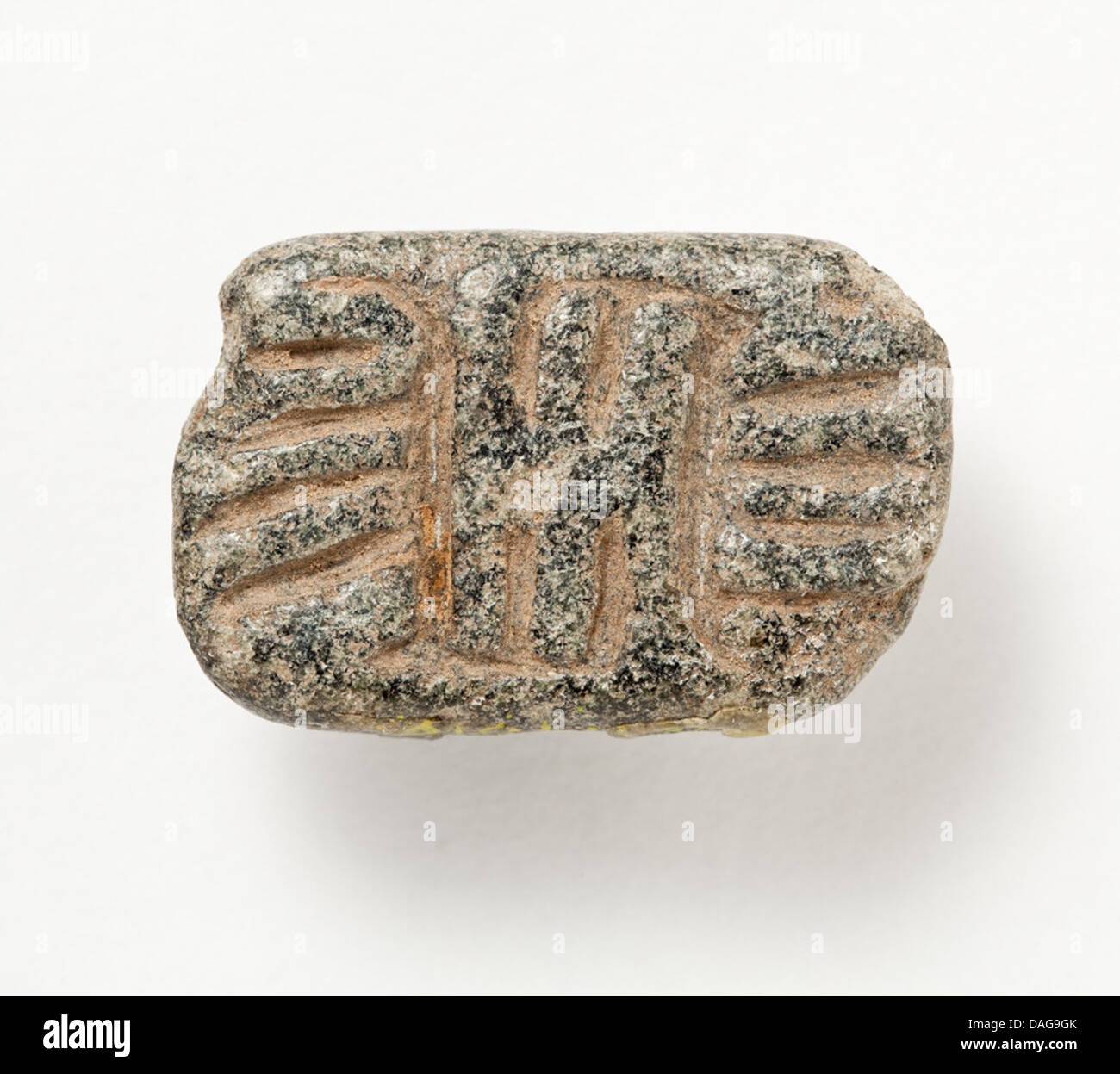 This gabled stamp, with a rounded back, is a unique example of ancient ...