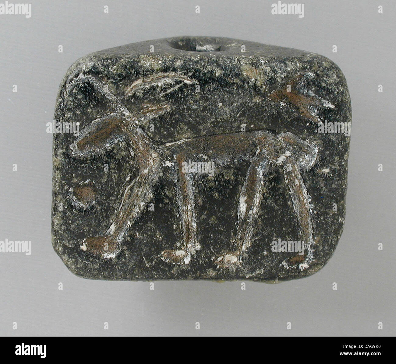This gabled stamp seal represents a detailed artifact from ancient ...