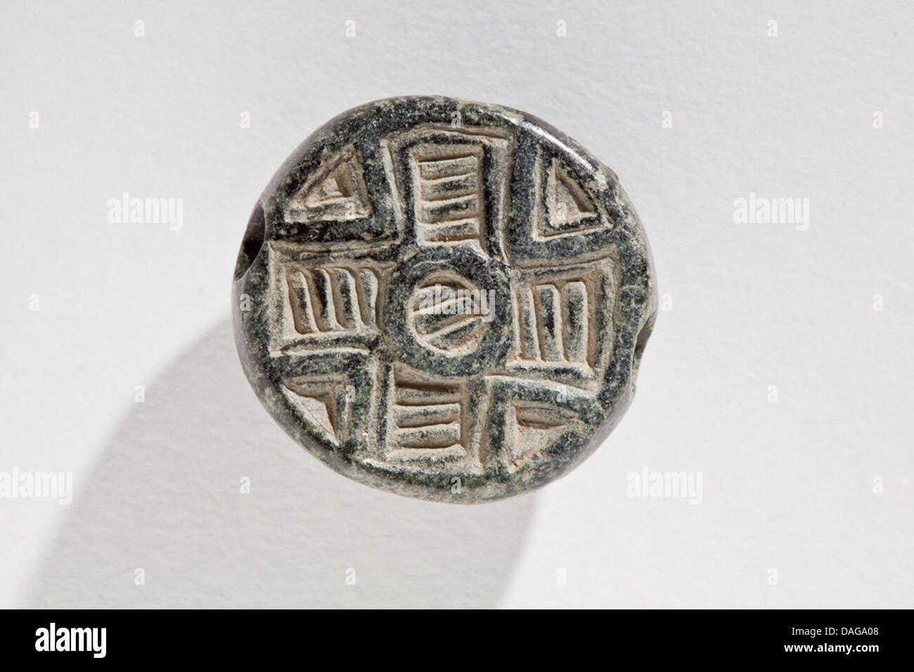 This hemispheroid stamp seal features flattened ends and intricate ...