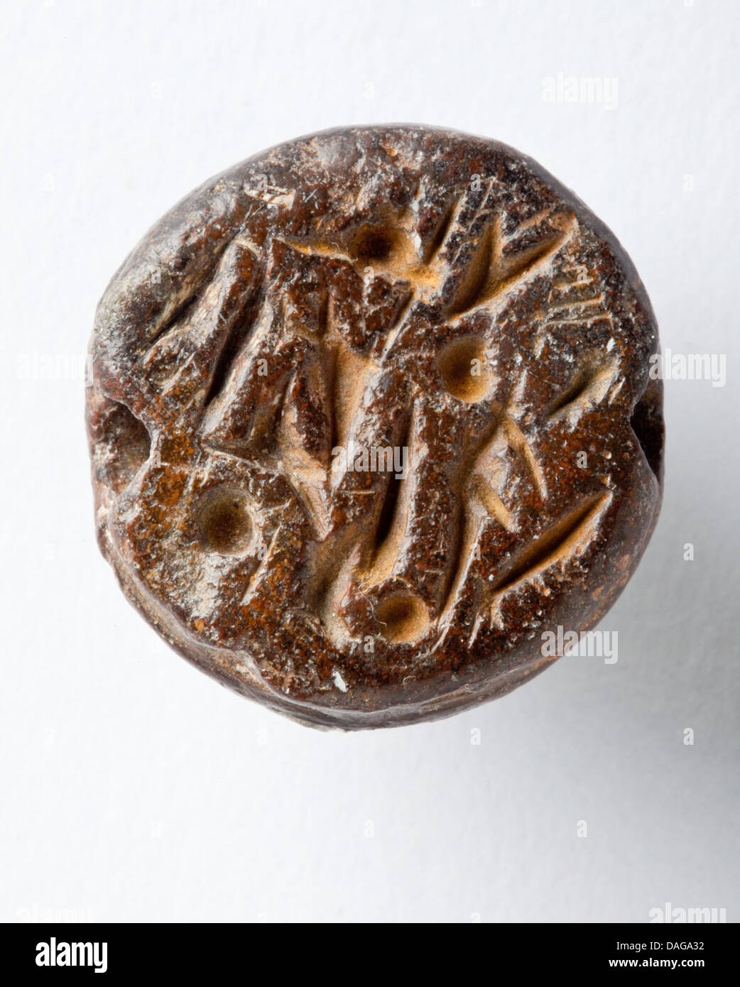 A semi-bulla-shaped stamp seal from the ancient world, crafted in ...
