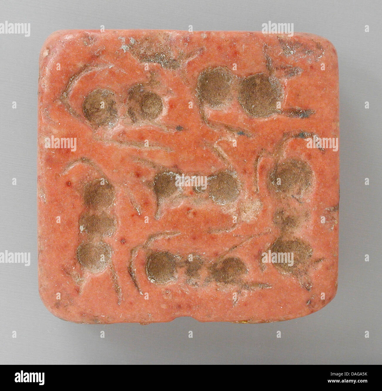 This stamp seal, often used for impressing documents, is an example of ...