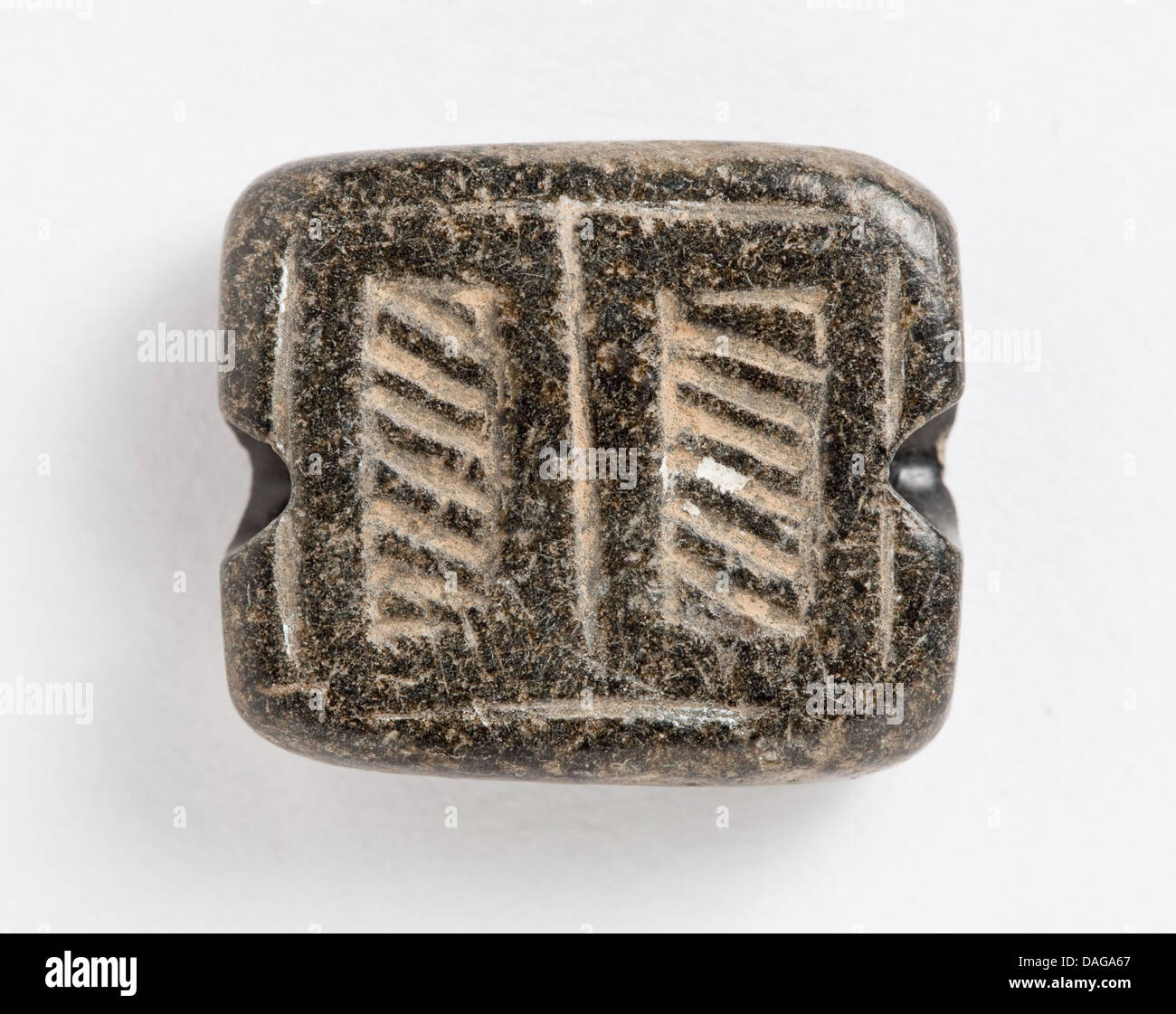 This stamp seal from the ancient world features a tabloid design, part ...