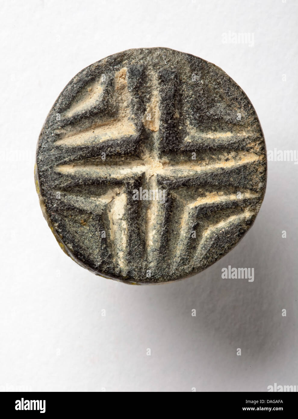 This stamp seal, originating from the ancient Near East, features ...
