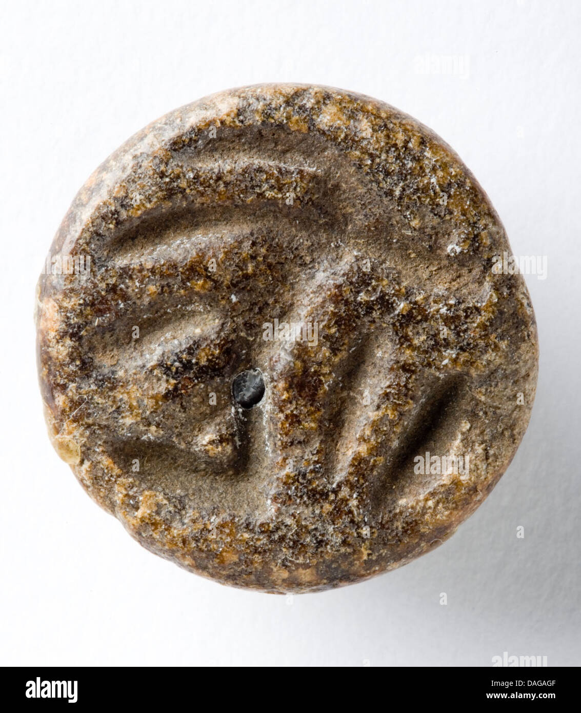 This ancient stamp seal, housed in LACMA, is finely crafted from bronze ...