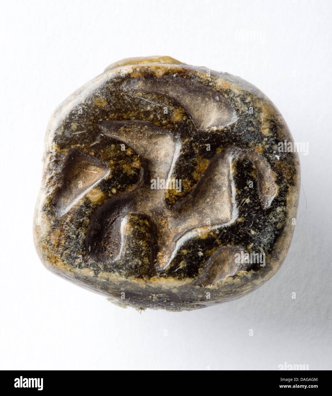 This stamp seal features an engraved design, typically used in ancient ...